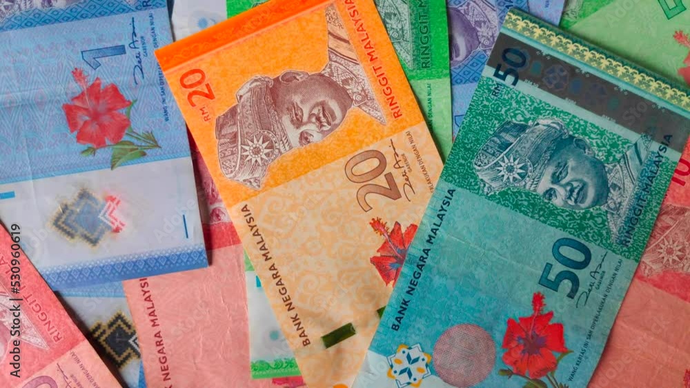 Rotating stack of Malaysian ringgit banknotes as background. Stock ...