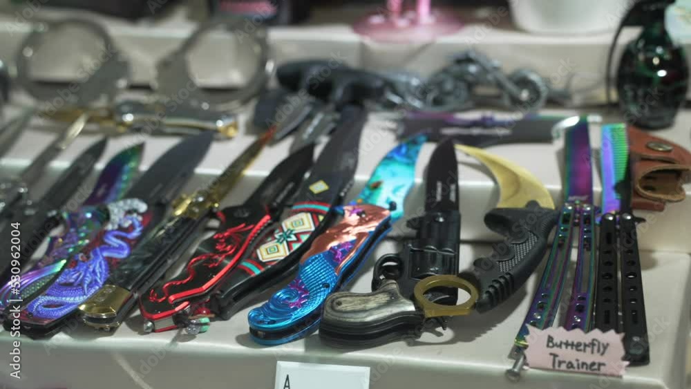 This video shows a store front display of switchblades and knife ...