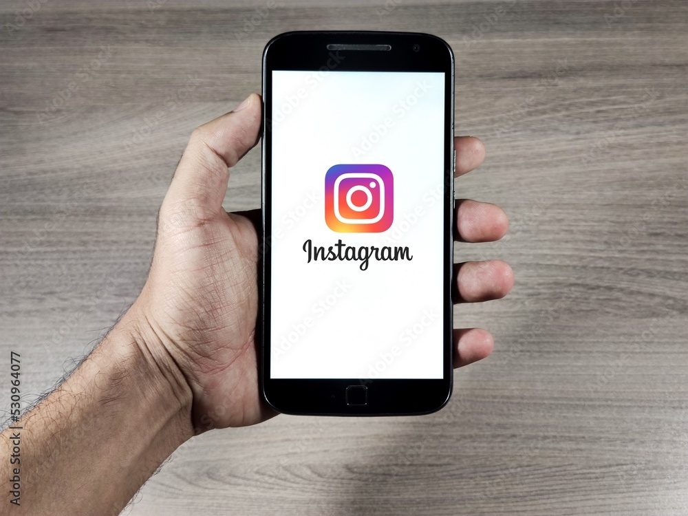 Instagram logo on the smartphone screen. Instagram is an online social ...