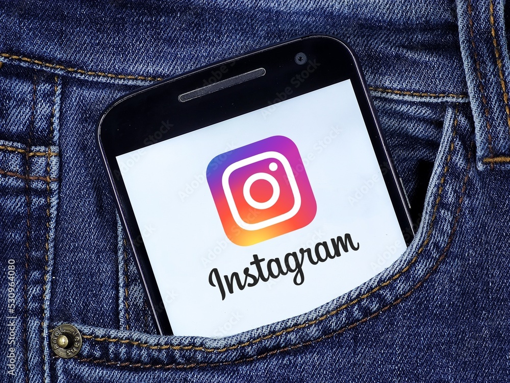 Instagram logo on the smartphone screen. Instagram is an online social ...