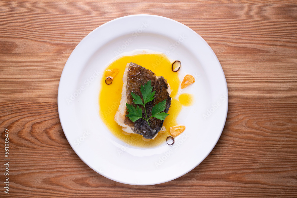 Bacalao al pil pil traditional tapa from the north of Spain. Coconut ...