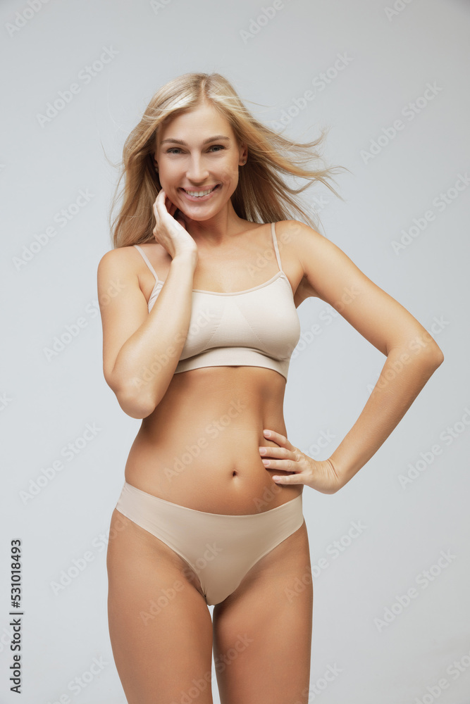 Young pretty slim 35 years old woman in cotton inner wear isolated over ...