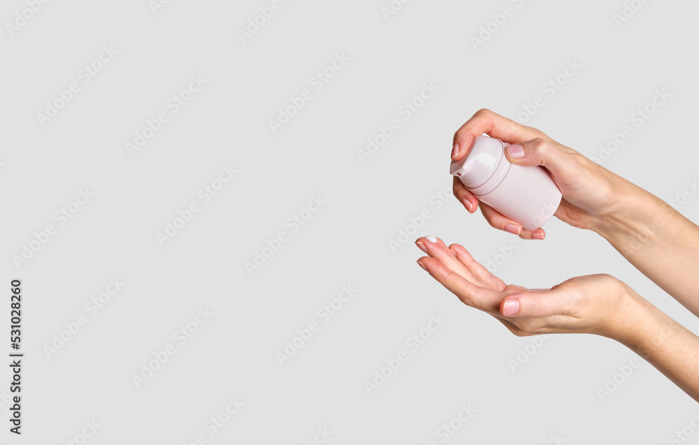 Woman applying lotion to hand. Cosmetic product branding mockup. Daily ...