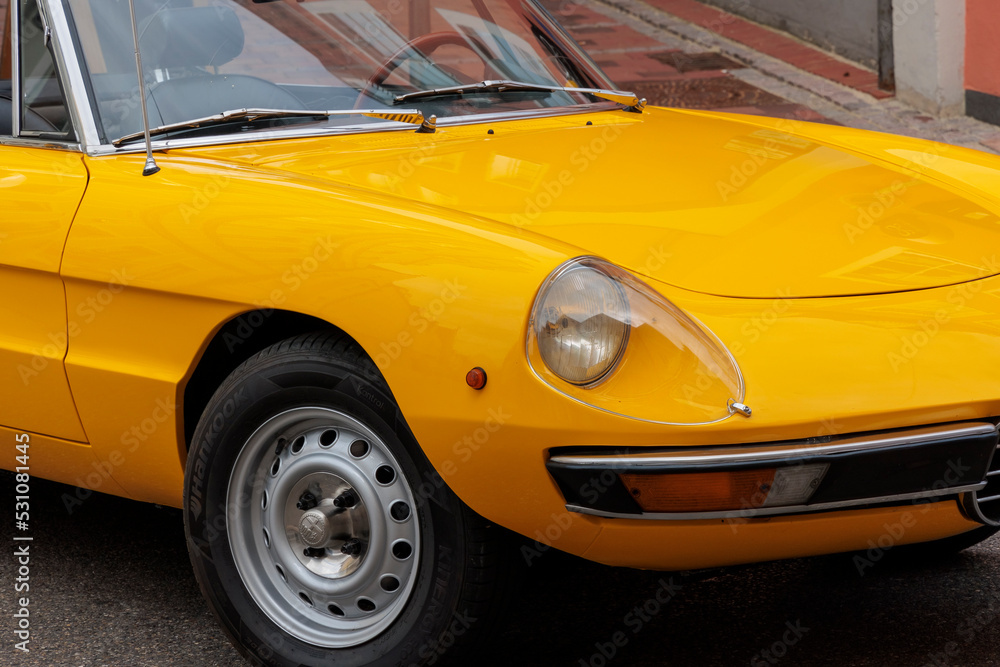 Germany Donauwörth 08-27-2022, Front headlights and hood of a yellow ...