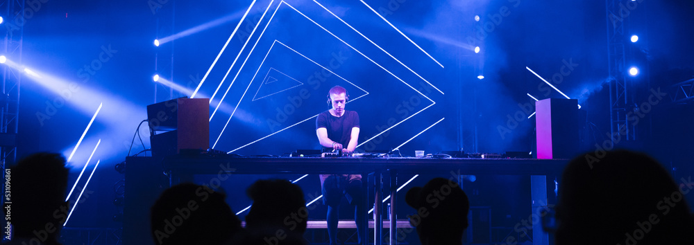 Dj playing techno music on the stage at the summer night concert Stock ...