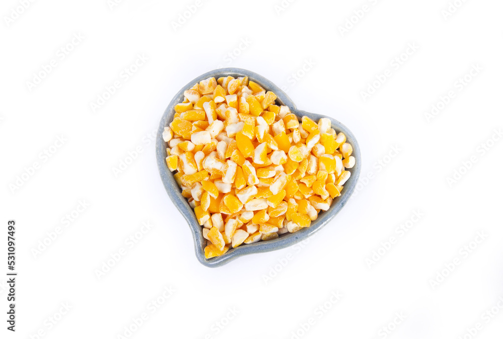 Golden Yellow Hominy Corn in Blue Heart Shaped Pottery Bowl Isolated on ...