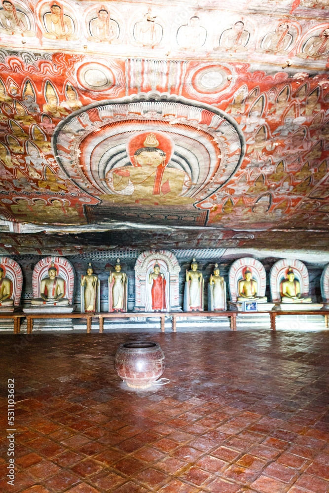 Buddhas inside of the rich decorated Buddhist cave temples in Dambulla ...