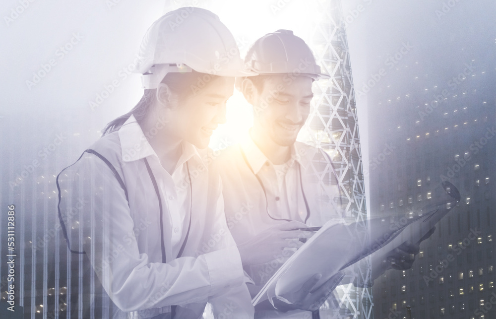 Engineer and architect smiling Discuss, review the construction ...