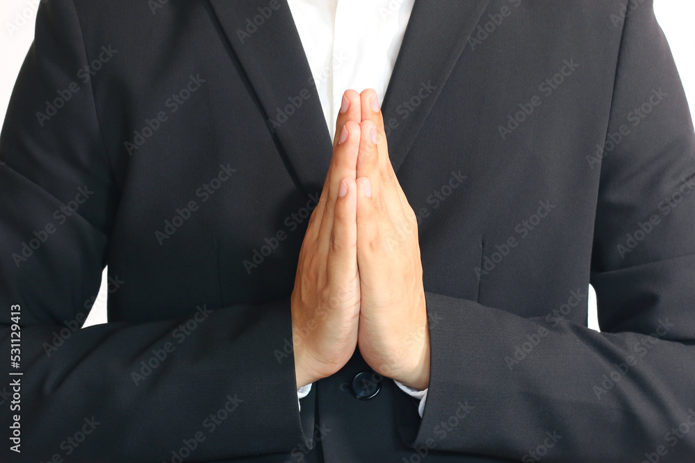 Asian businessman put his hands together as a greeting sign. Hello ...