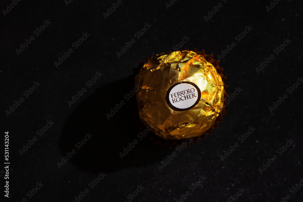 September 7, 2022 Ukraine city Kyiv candy Ferrero Rocher on a black ...