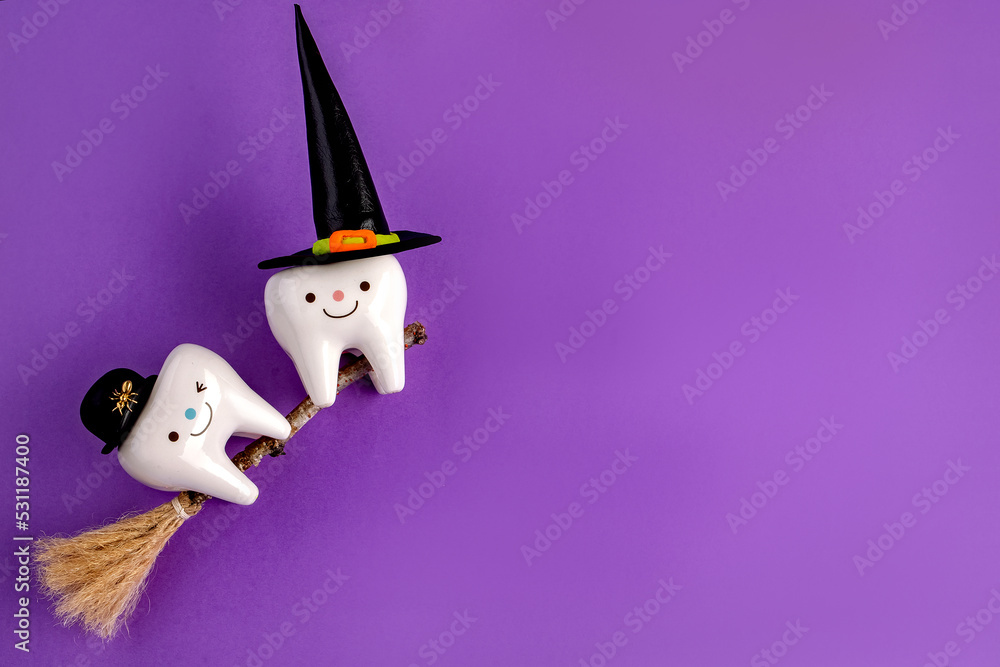 dental concept. figurines of teeth in halloween costumes and dental ...