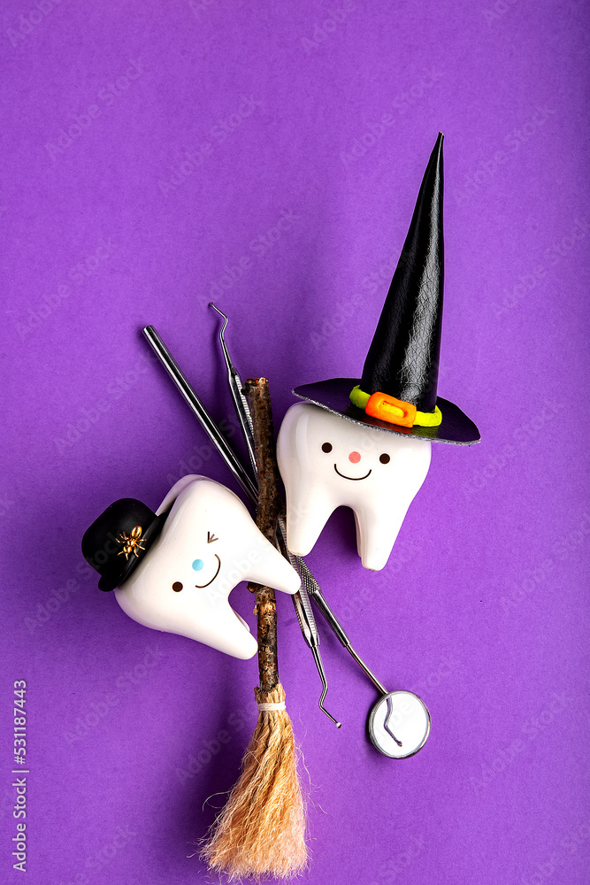 dental concept. figurines of teeth in halloween costumes and dental ...