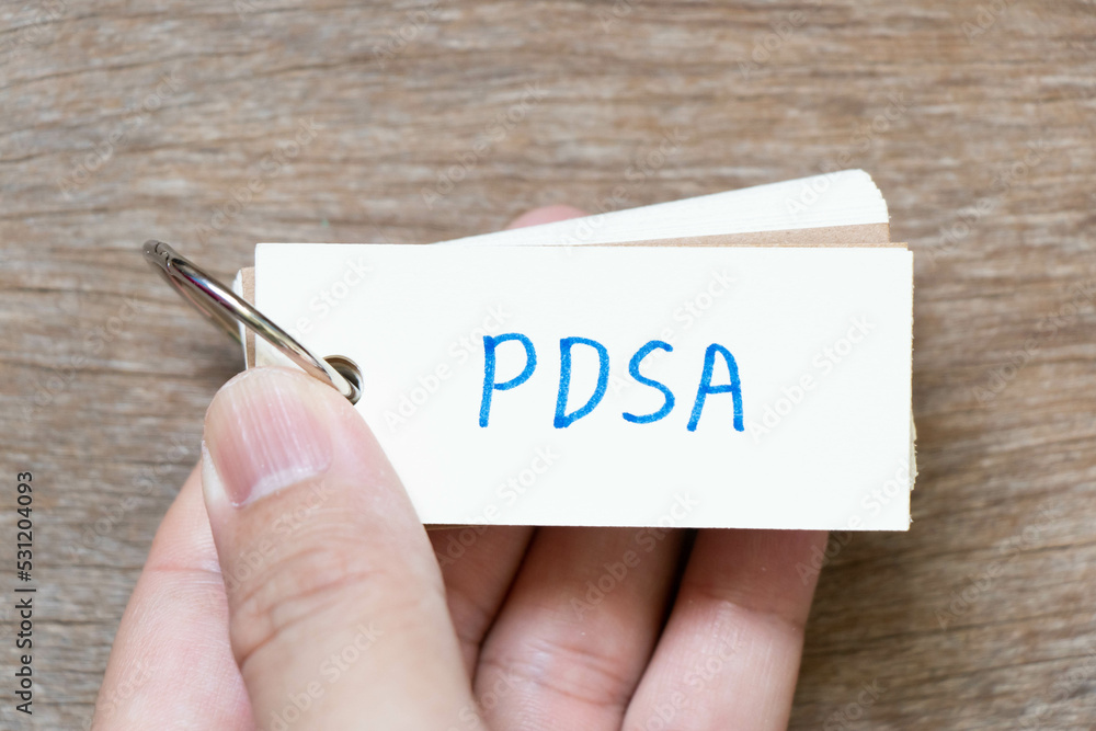 Hand hold flash card with handwriting in word PDSA (Abbreviation of ...