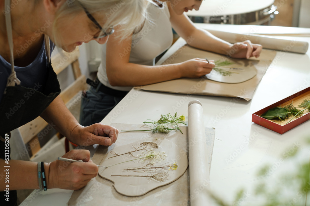Pottery workshop in studio. master working with clay on the table ...
