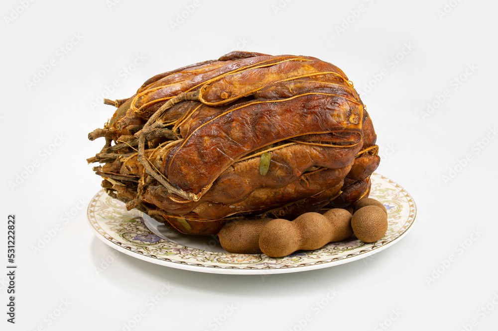 Ripe peeled Tamarind stack on white background. Scientific name ...