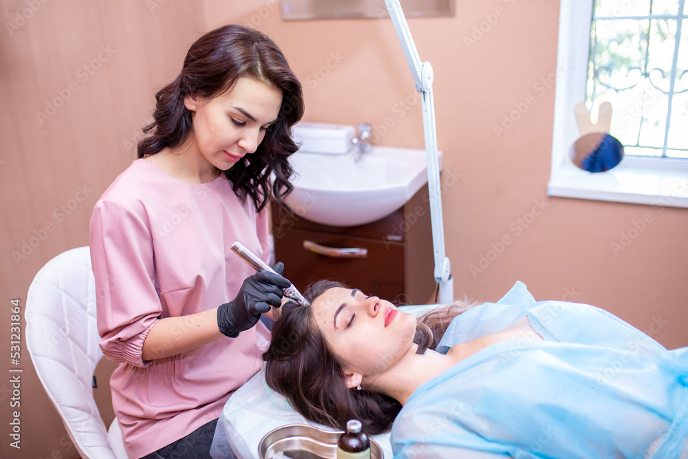 Treatment of the scalp for hair loss, alopecia. A trichologist doctor ...