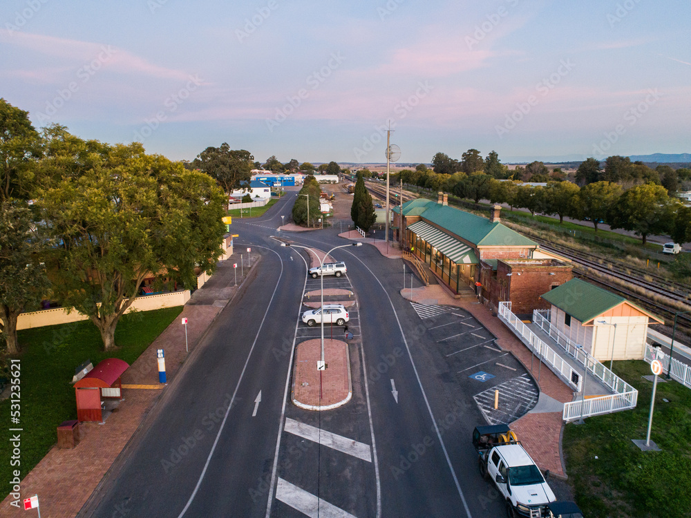 Aerial view of road, bus shelter and train station showing public ...