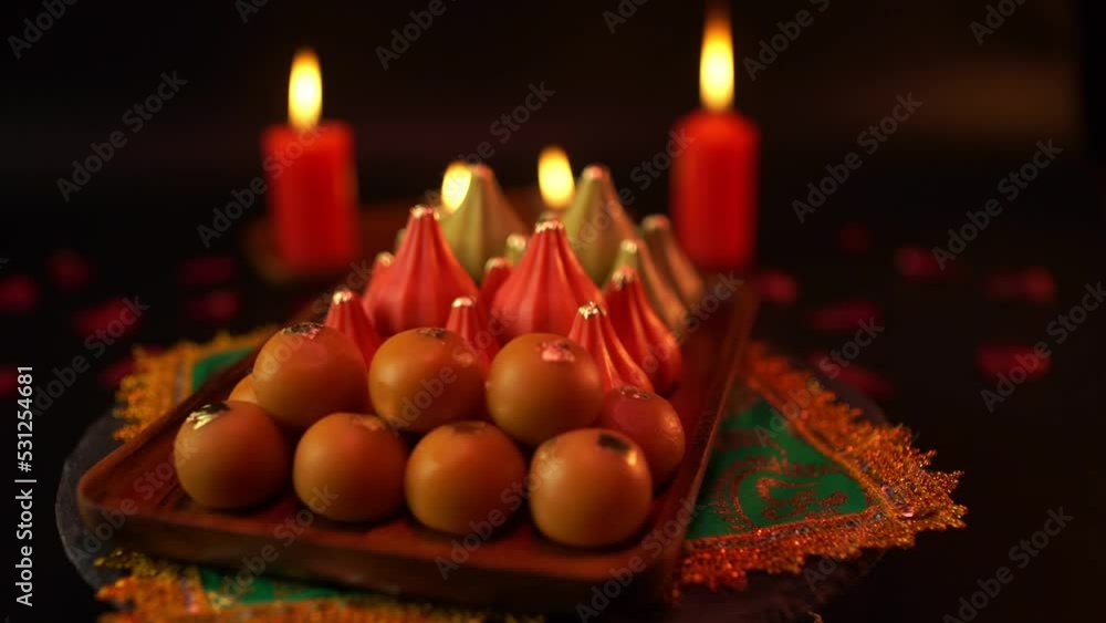 Ladu modaka dessert for Lord Ganesha on a tray ready to be worshiped ...