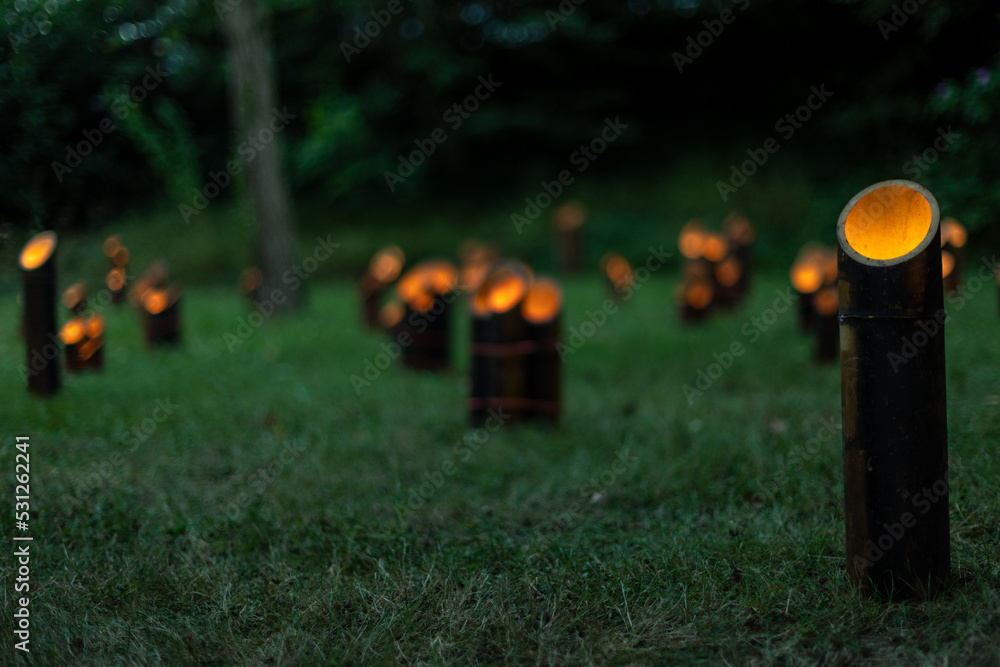 Hundreds of Japanese bamboo lanterns - candles in bamboo stands ...