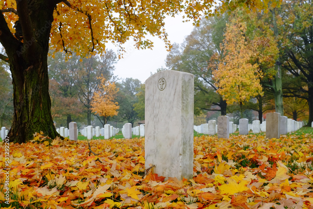 Headstones in autumn foliage in Arlington National Cemetery - Circa ...