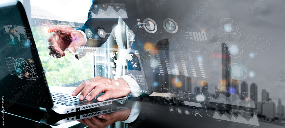 A guy programmer uses a laptop to evaluate and produce data on a future ...