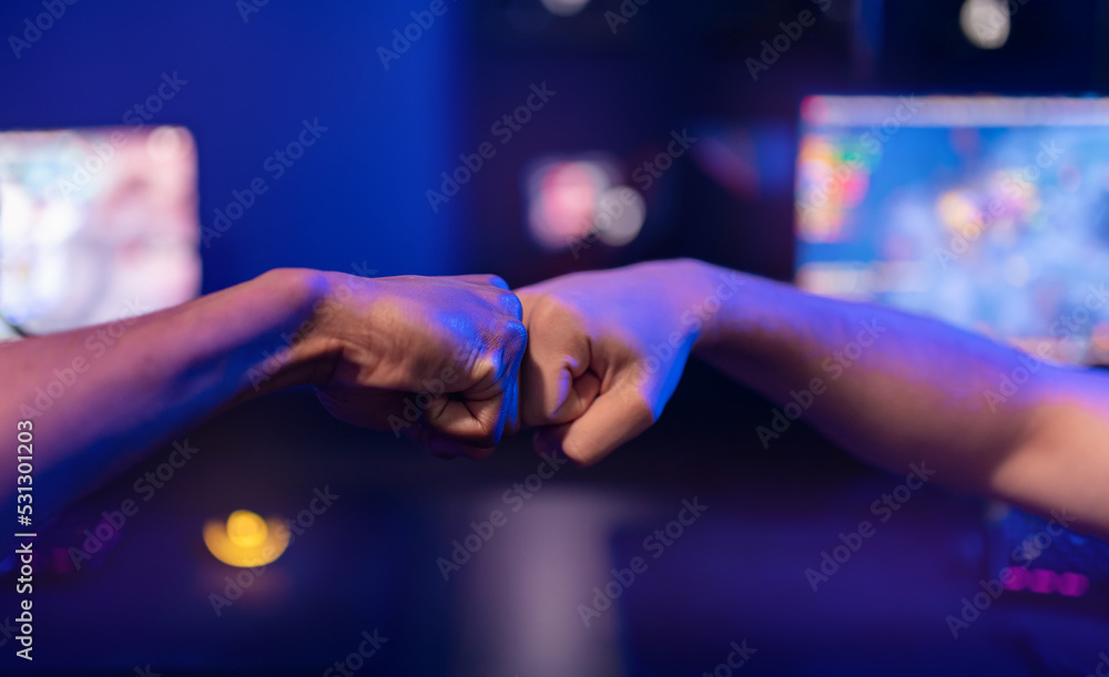 Professional gamer African and caucasian people hands greeting and ...