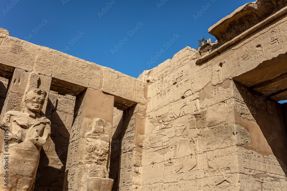 Different hieroglyphs on the walls and columns in the Karnak temple ...