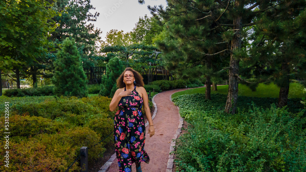black woman walking around happy and cheerful in an outdoor Chicago ...