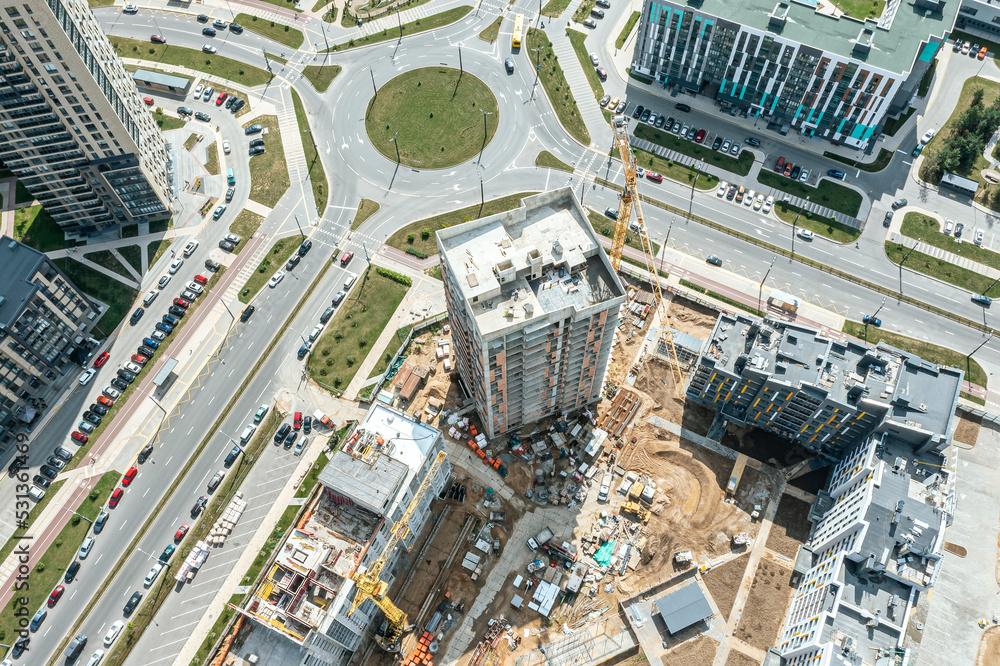 building site with high-rise building and cranes. construction site in ...