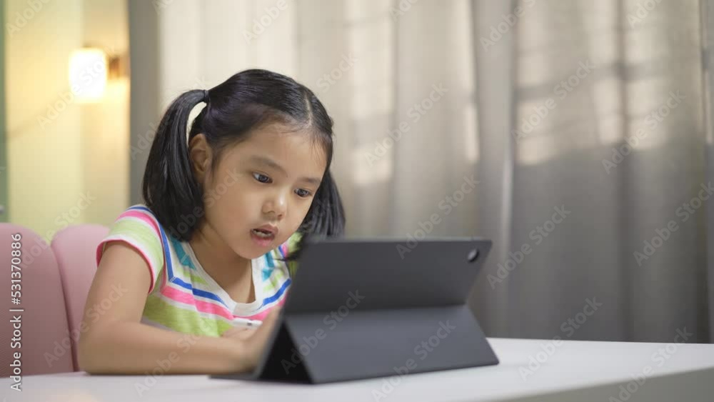 asian child student drawing learning on computer tablet screen by touch ...