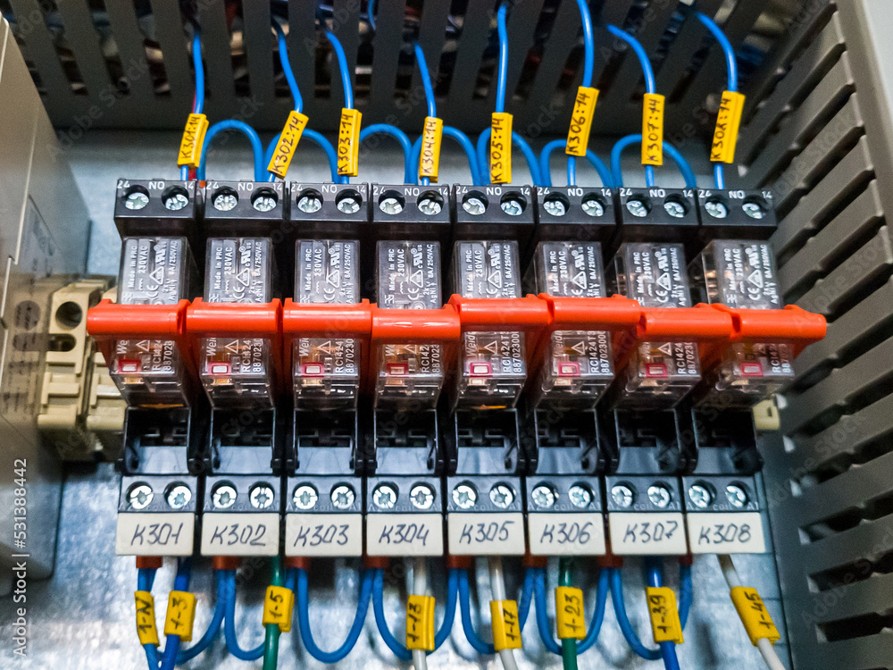 Row of relays installed in electrical cabinet of automation system in ...