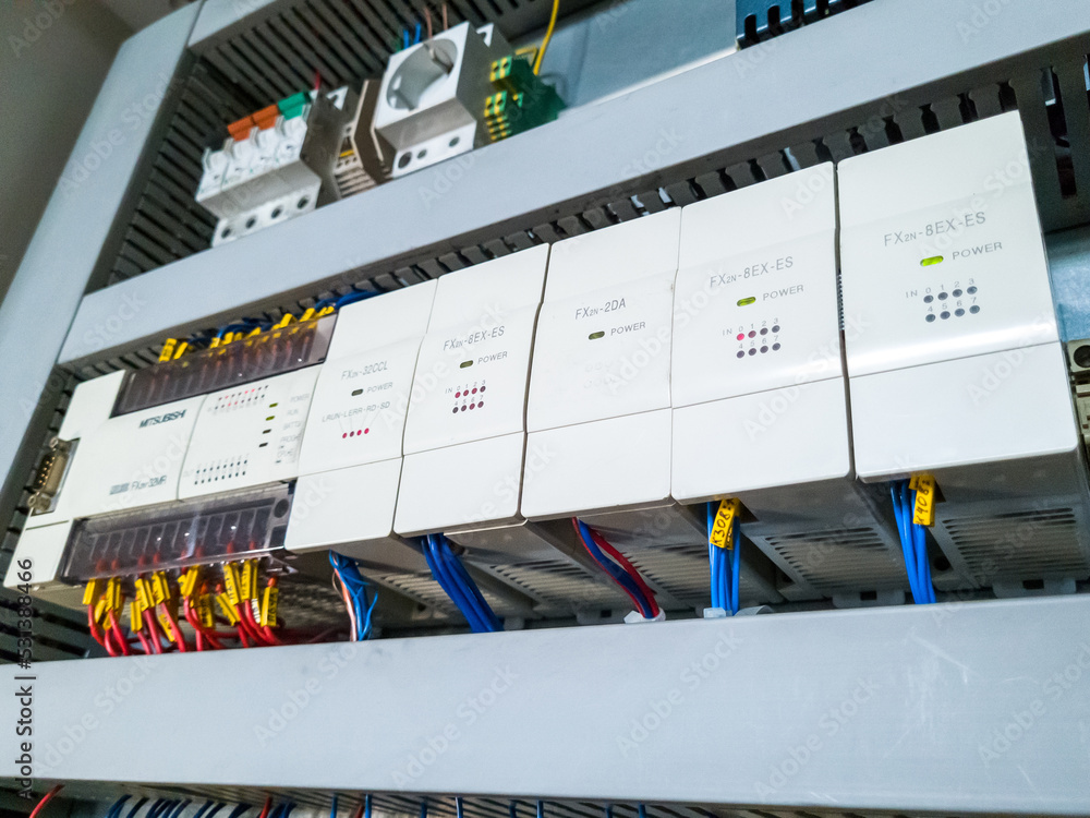 Mitsubishi PLC modules in a row in electrical cabinet of automation ...