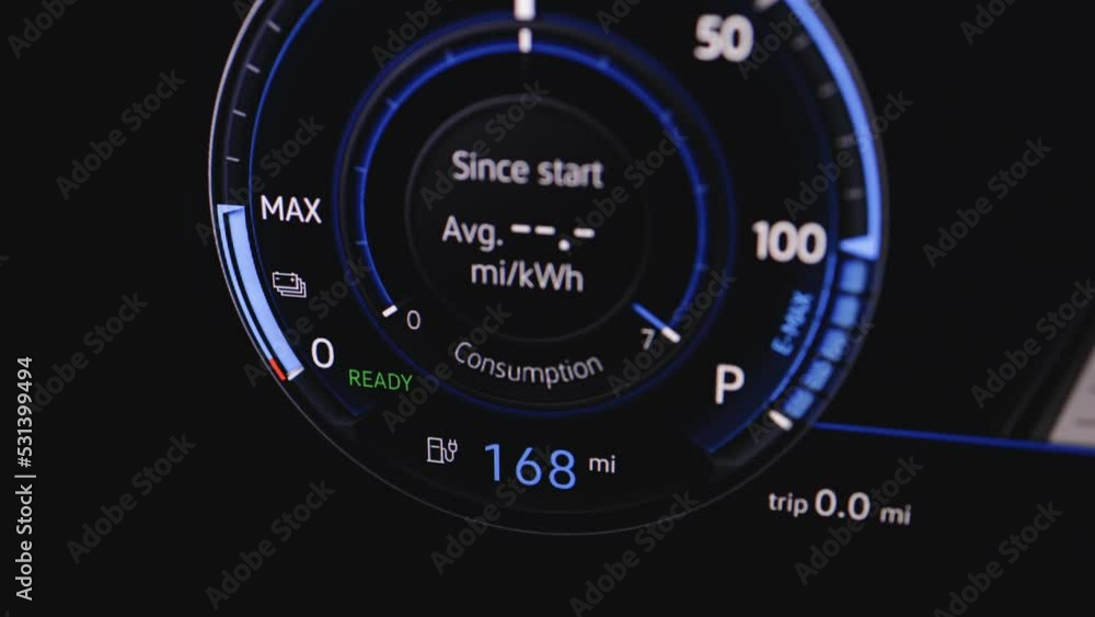Close up of electric car dashboard display. The battery indicator shows ...