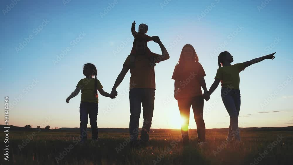 people in the park. happy family walking together in the park ...