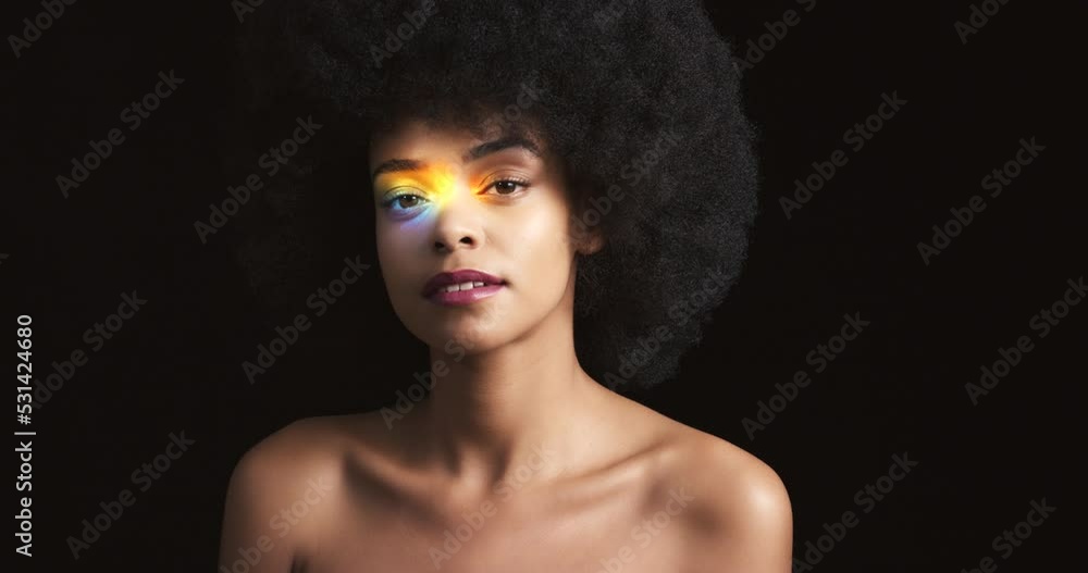Prism rainbow, reflection and light on a black woman model in a ...
