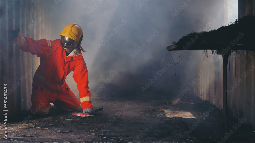 Firefighter fighting with fire flame protection property. Fireman wear ...