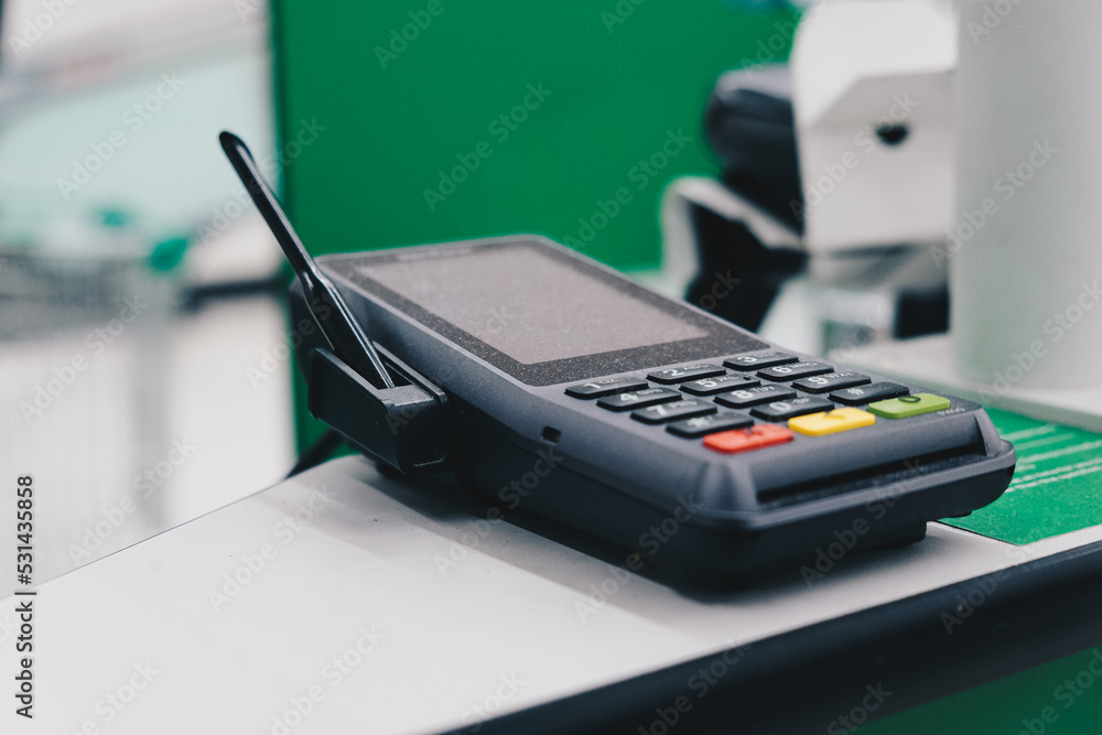 Credit card reader machine at bar counter in supermarket Stock Photo ...