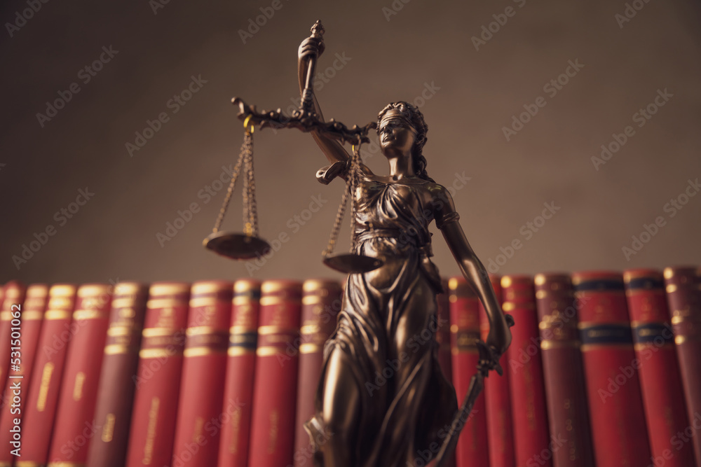 picture of bronze law statue holding the balance between good and bad ...