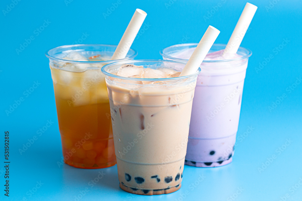 Three Different Types of Boba Tea on a Bright Blue Background Stock ...