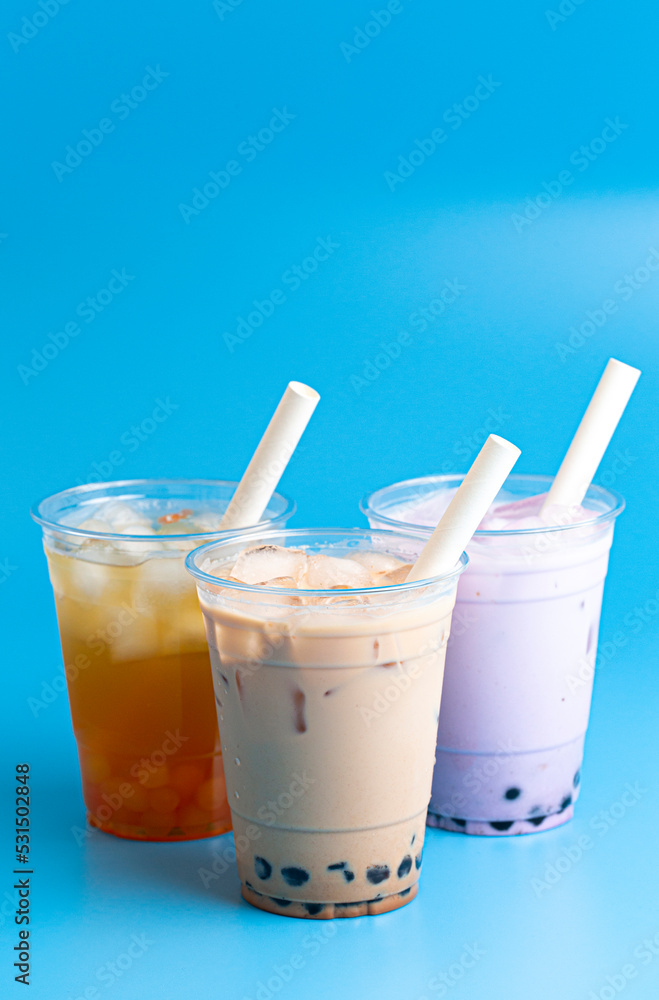 Three Different Types of Boba Tea on a Bright Blue Background Stock ...