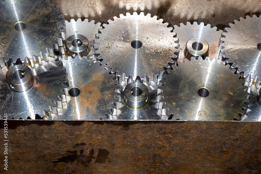 Large metal gears covered with sulfofresol feed in a rusty box ...