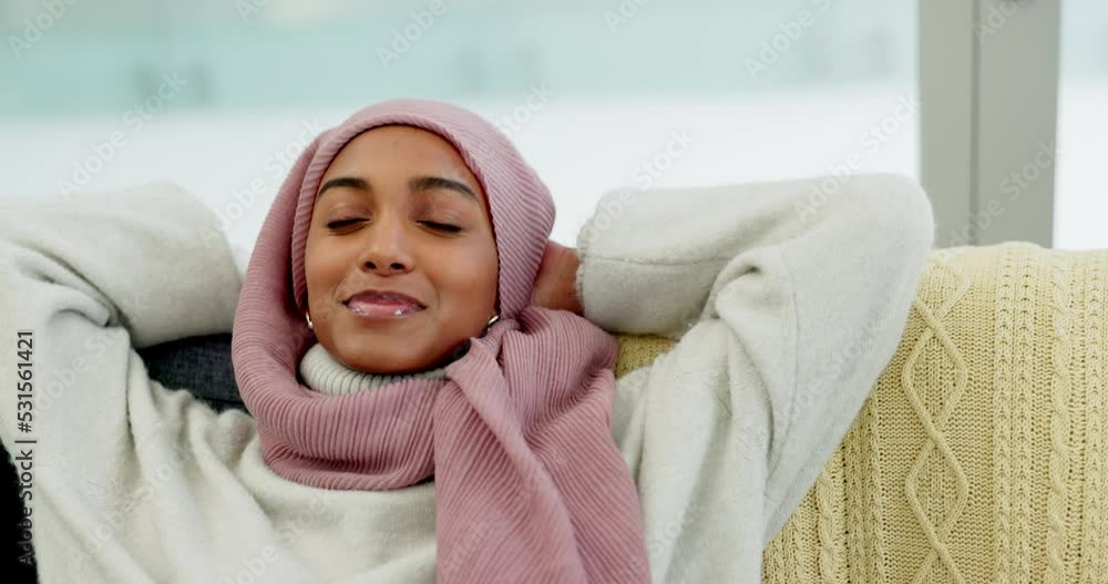 Relax, freedom and happy with a muslim woman sitting on a sofa in her ...