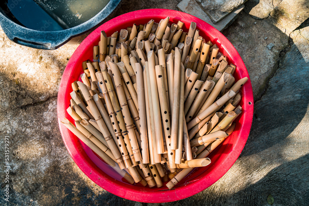 Stacks of semi-finished bamboo flutes, handmade bamboo flute production ...
