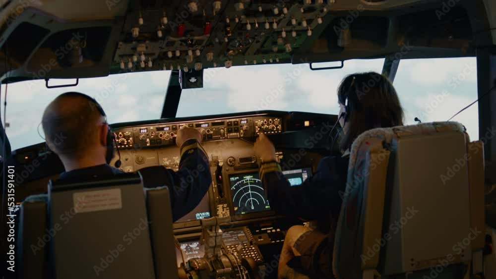 Team of aviators throttling power engine and fixing altitude level ...