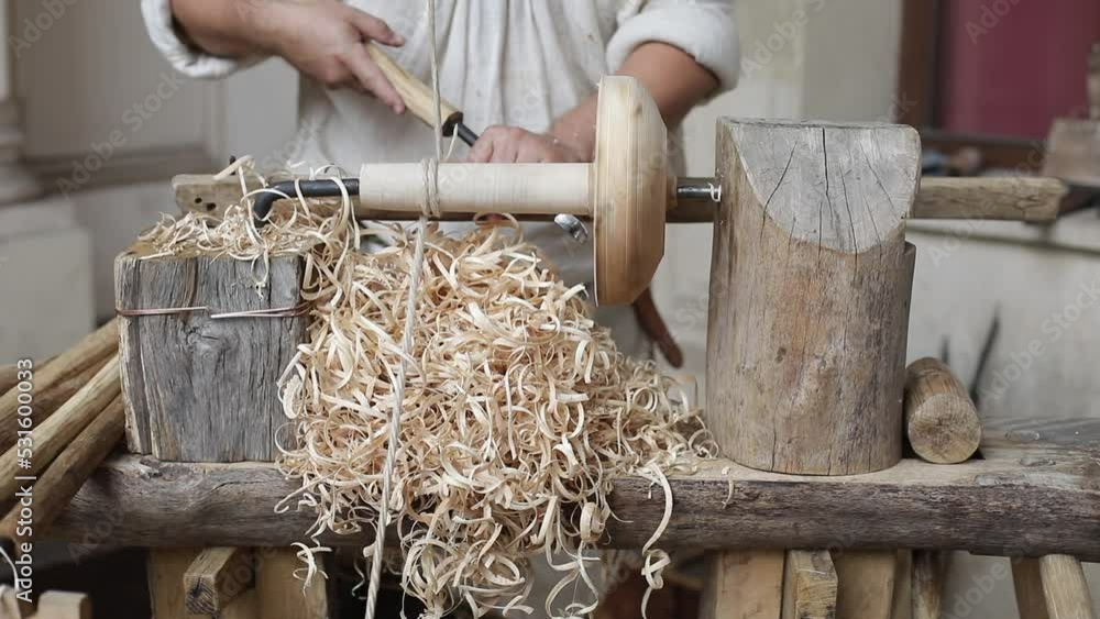 Handheld footage with a craftsman using an ancient Roman woodturning ...