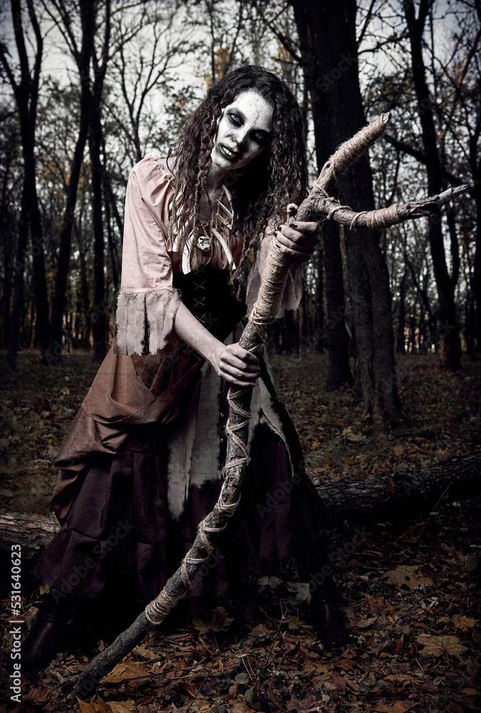 Halloween (Samhain) theme: ugly fearful voodoo witch with staff ...
