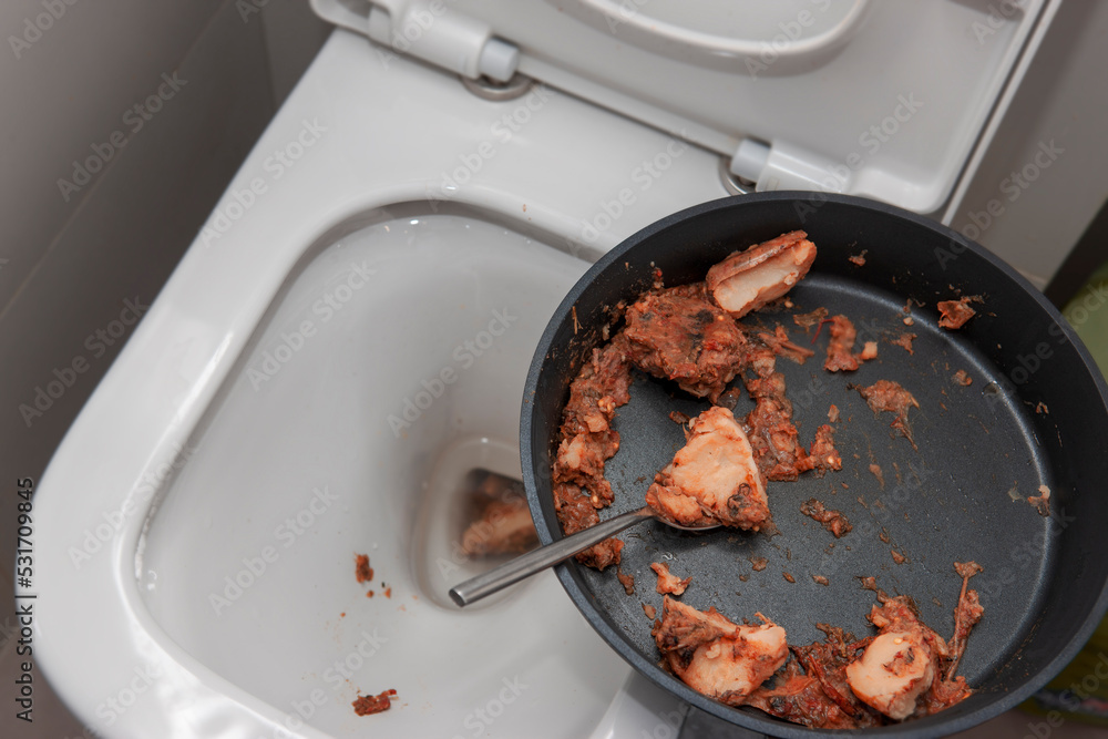 throwing away a stinky dish Stock Photo | Adobe Stock