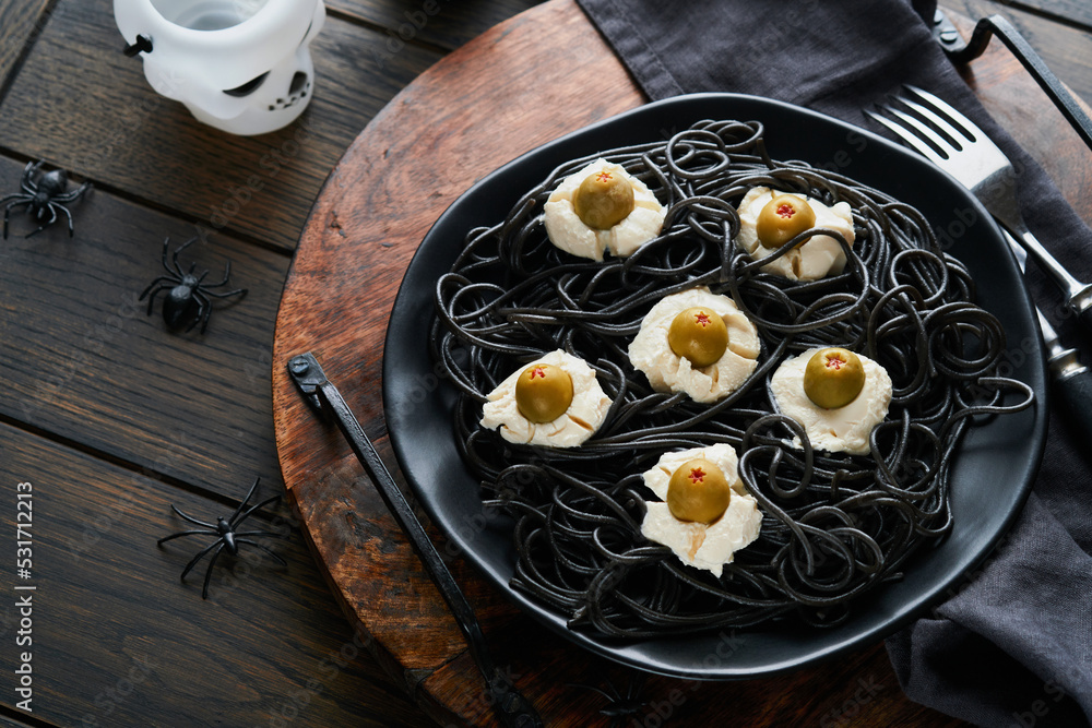 Halloween party Italian black pasta decorated horror olives like eyes ...