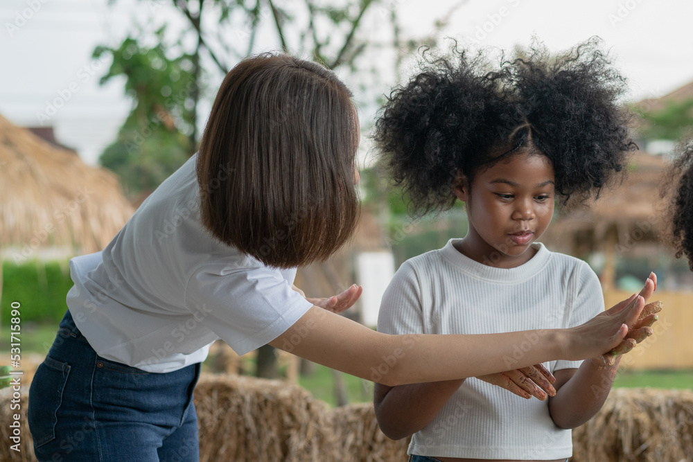Group of children playing colourful water colours and colour stain on ...