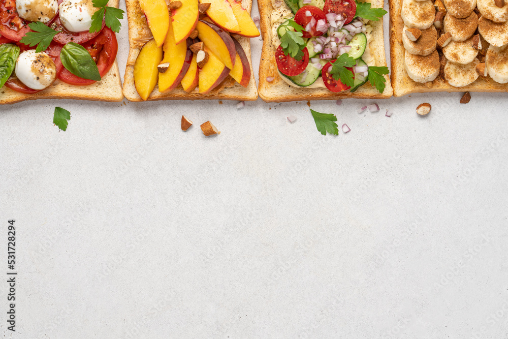 Set of various toasts on white background, top view. Mozzarella ...
